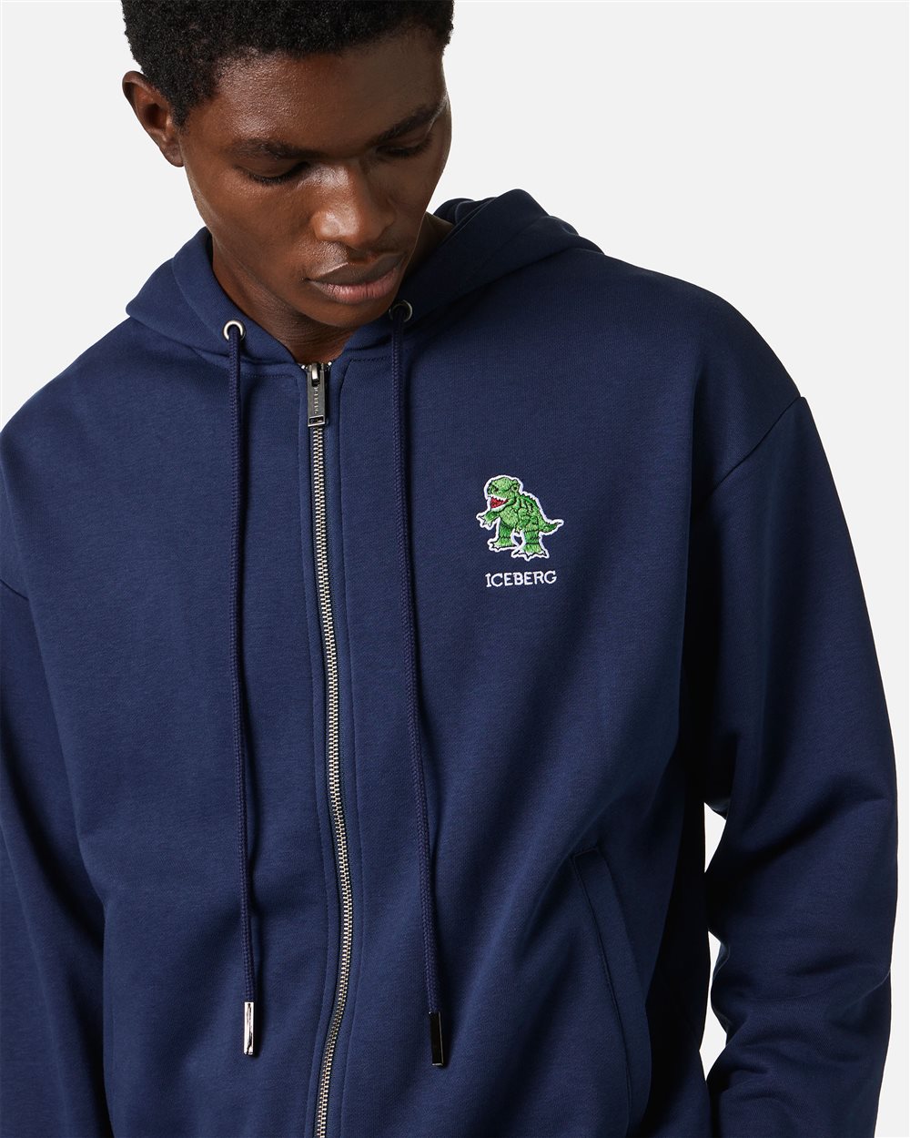 Blauer Kapuzenpullover aus Baumwollsweatstoff im Regular Fit mit Dino ...